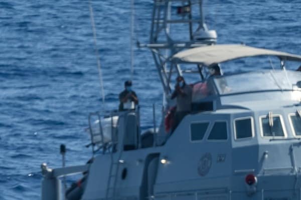 Migrant rescue boat comes under heavy machine gunfire - London Business ...